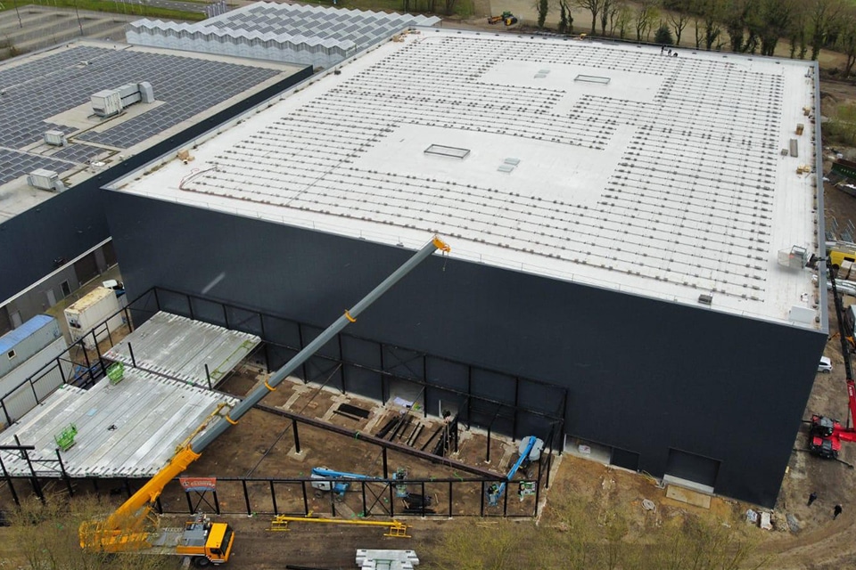 Façade and roof cladding of black perforated plate