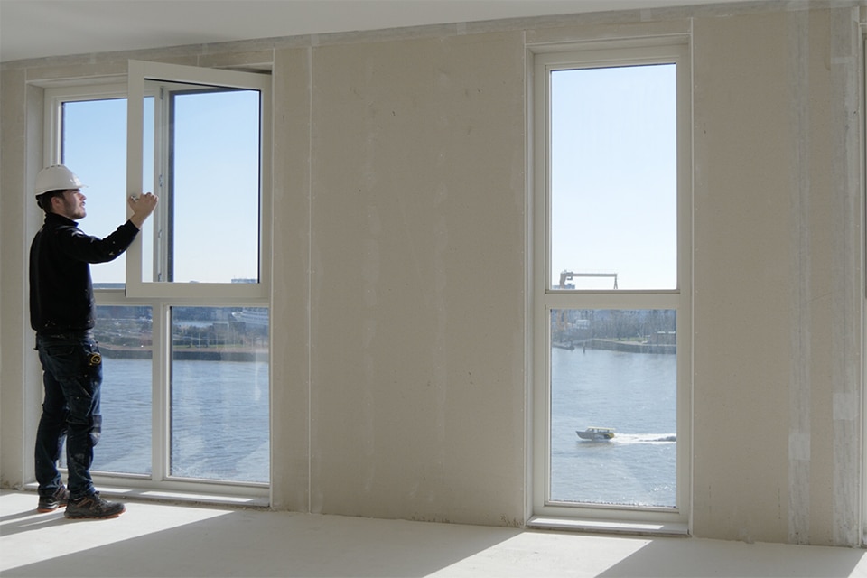 Hybrid window frames for landmark residential tower